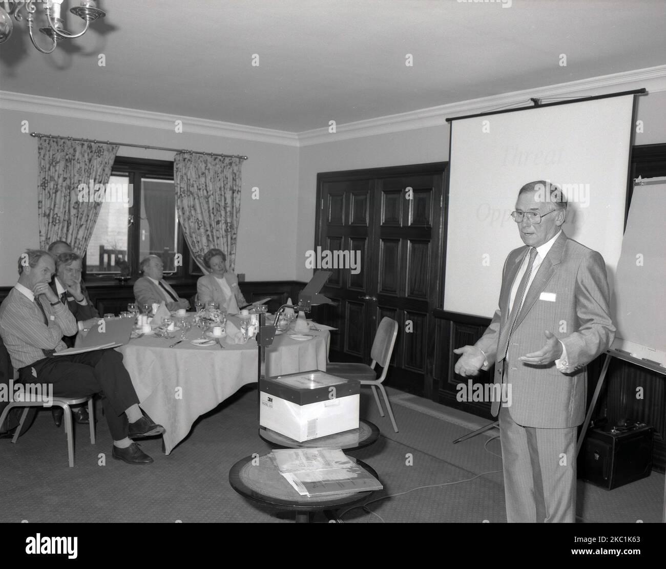 1980s, historical, management training, in a hotel conference room ...