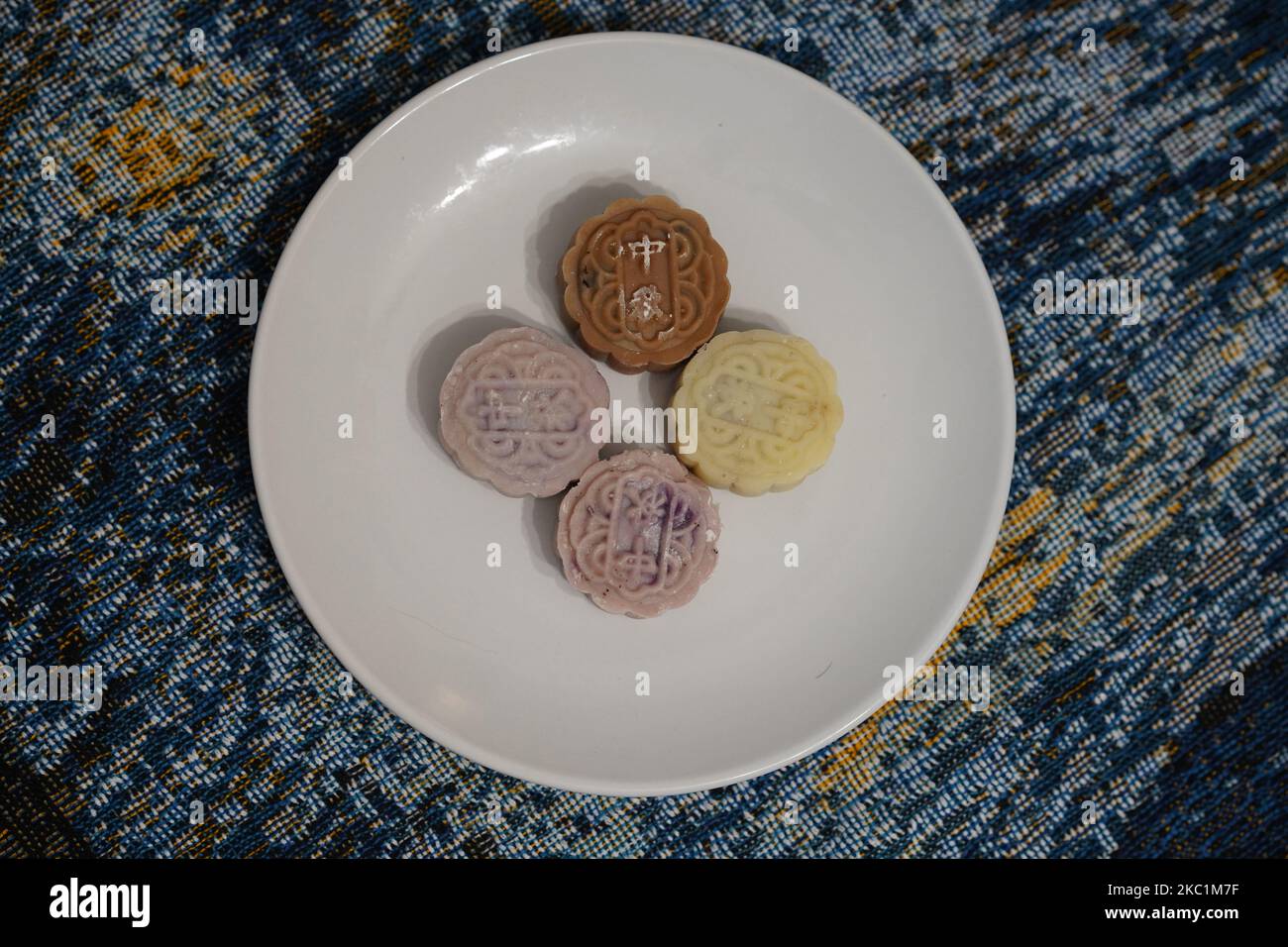 A top view of pandan snow skin mooncakes served in a white plate Stock ...
