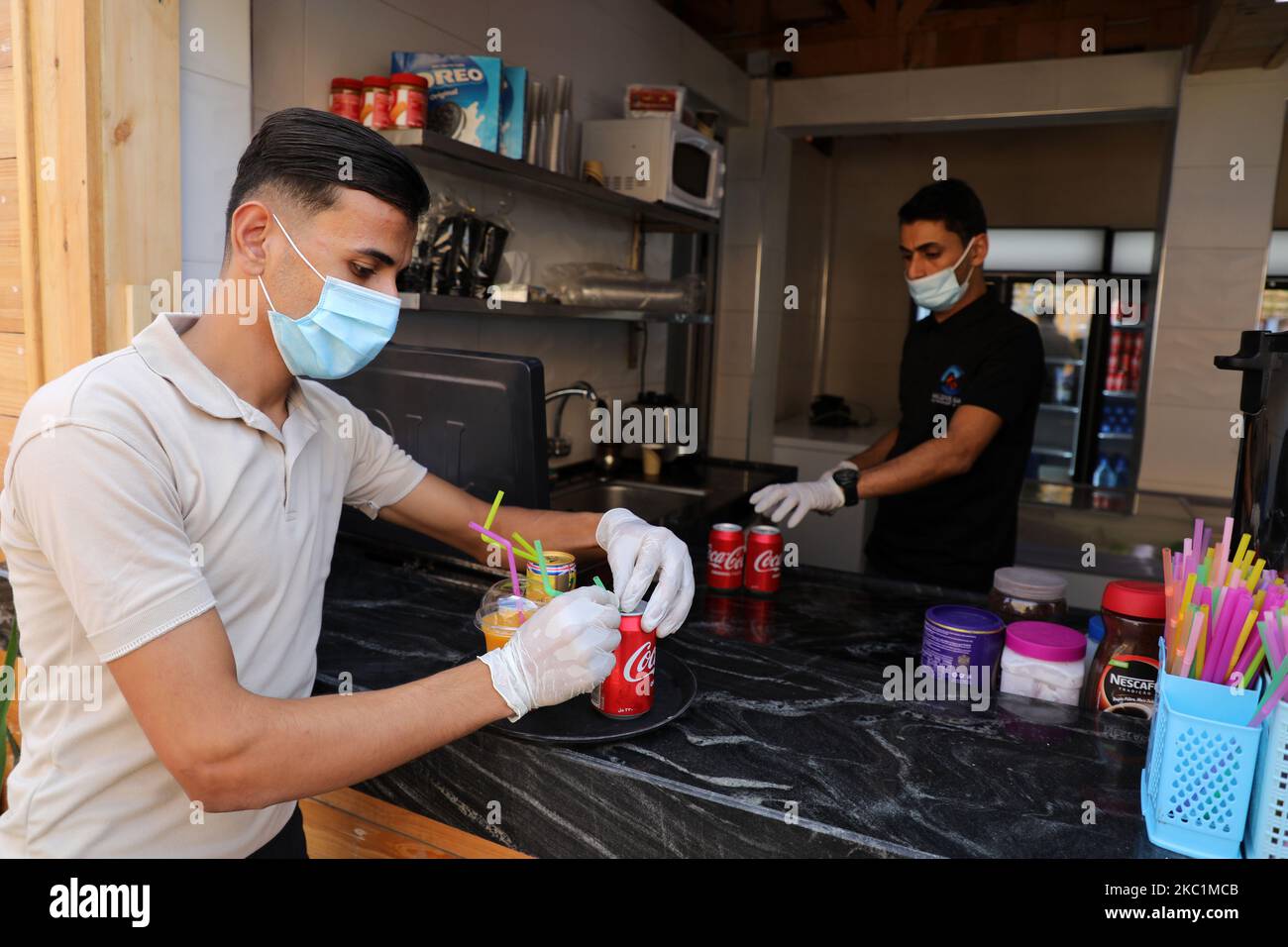 APalestinian worker at a beach side cafe in Gaza City, Monday, Oct. 12 ...