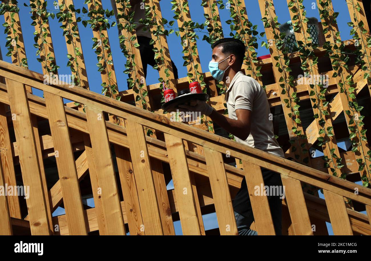 APalestinian worker at a beach side cafe in Gaza City, Monday, Oct. 12 ...