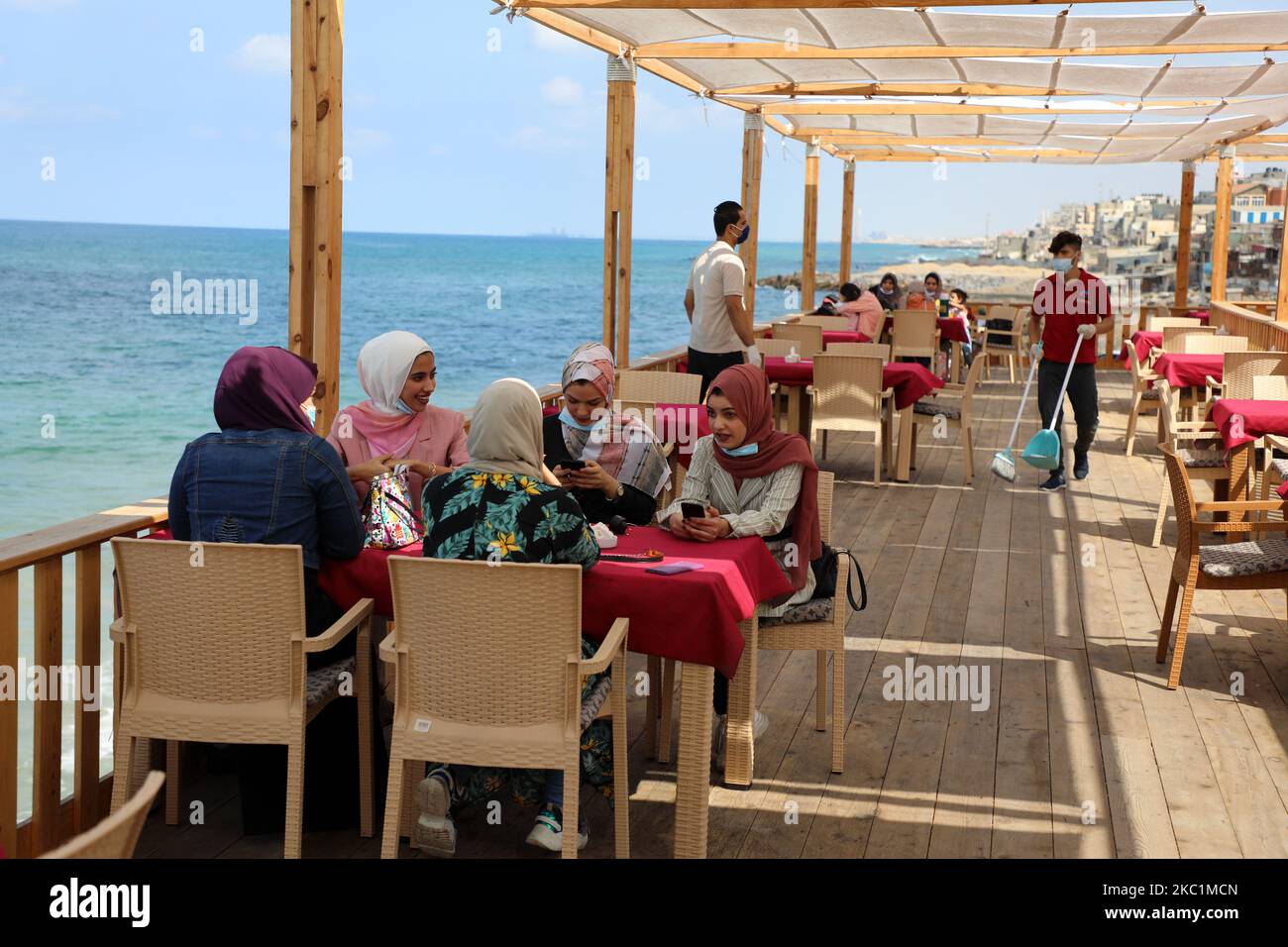 Women enjoy their time at a beach side cafe in Gaza City, Monday, Oct ...