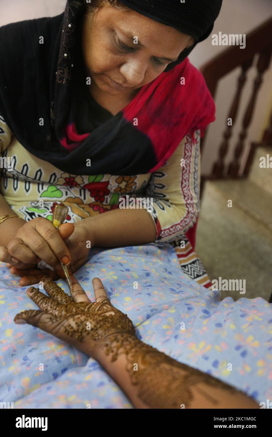 Bridal henna is applied to the hands and feet of a Hindu bride the ...