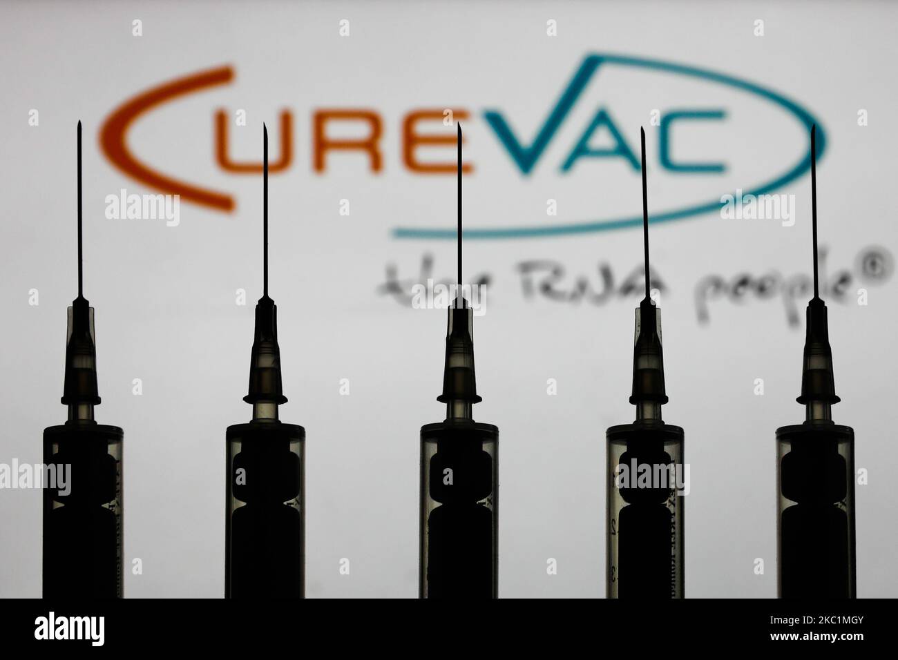 Medical syringes are seen with CureVac company logo displayed on a ...