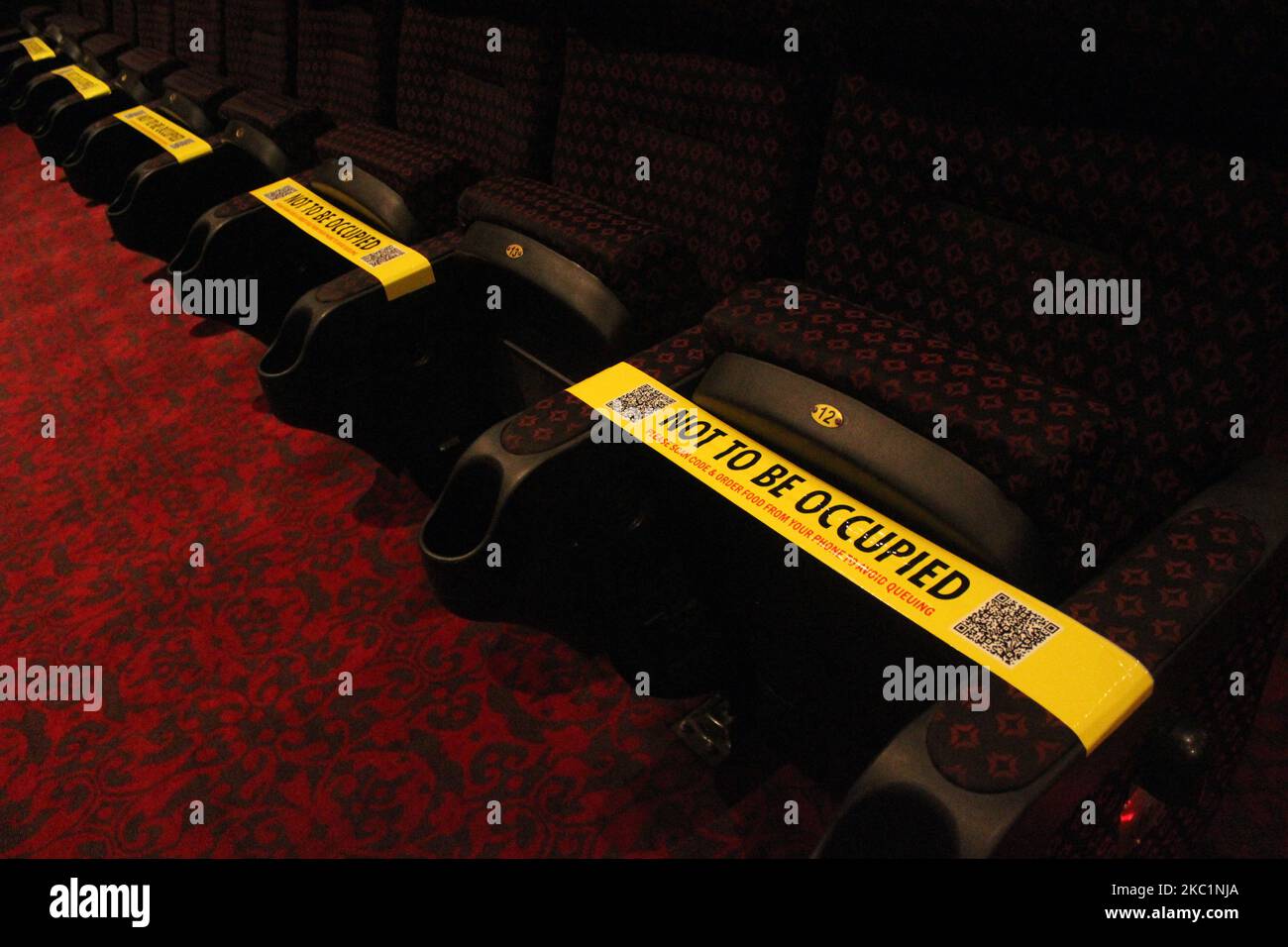 Social distancing markers are seen inside a theatre hall ahead of the ...