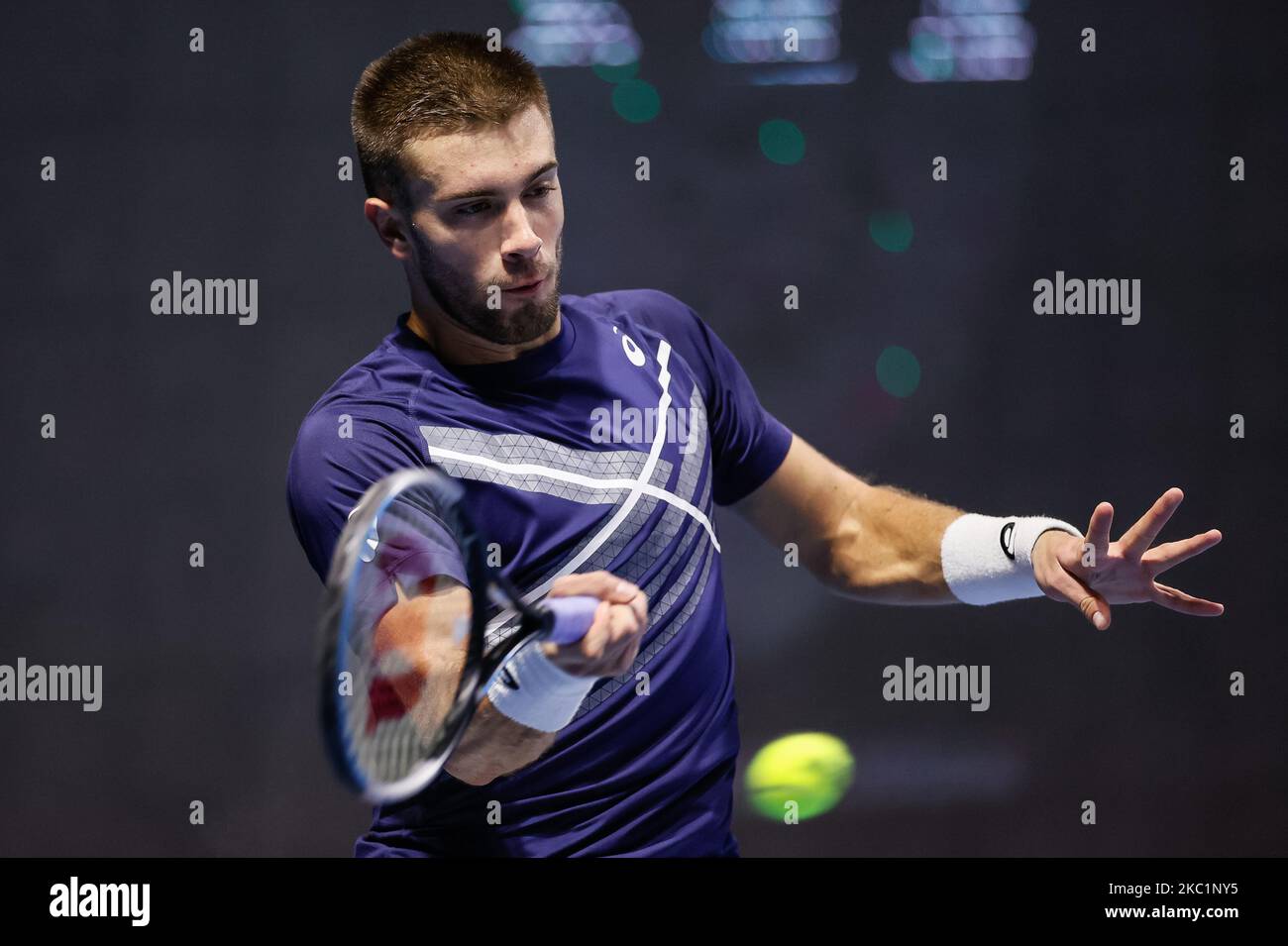 Borna Coric of Croatia returns the ball to Feliciano Lopez of Spain ...