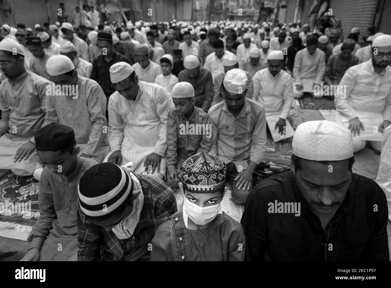 The Muslim men offering prayers on Eid, close-up, grayscale Stock Photo ...
