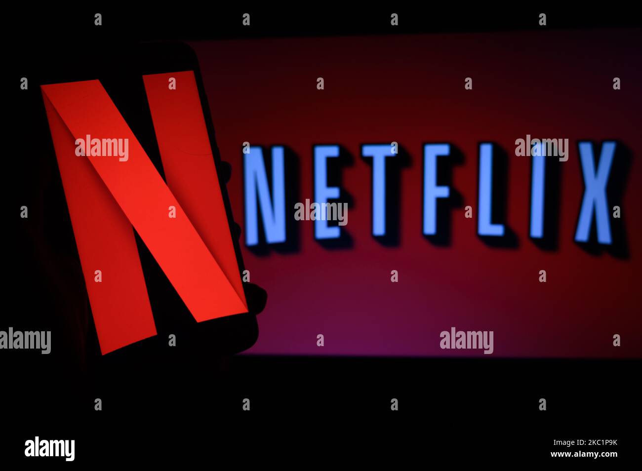 In this photo illustration, the logo of Netflix is displayed on a ...
