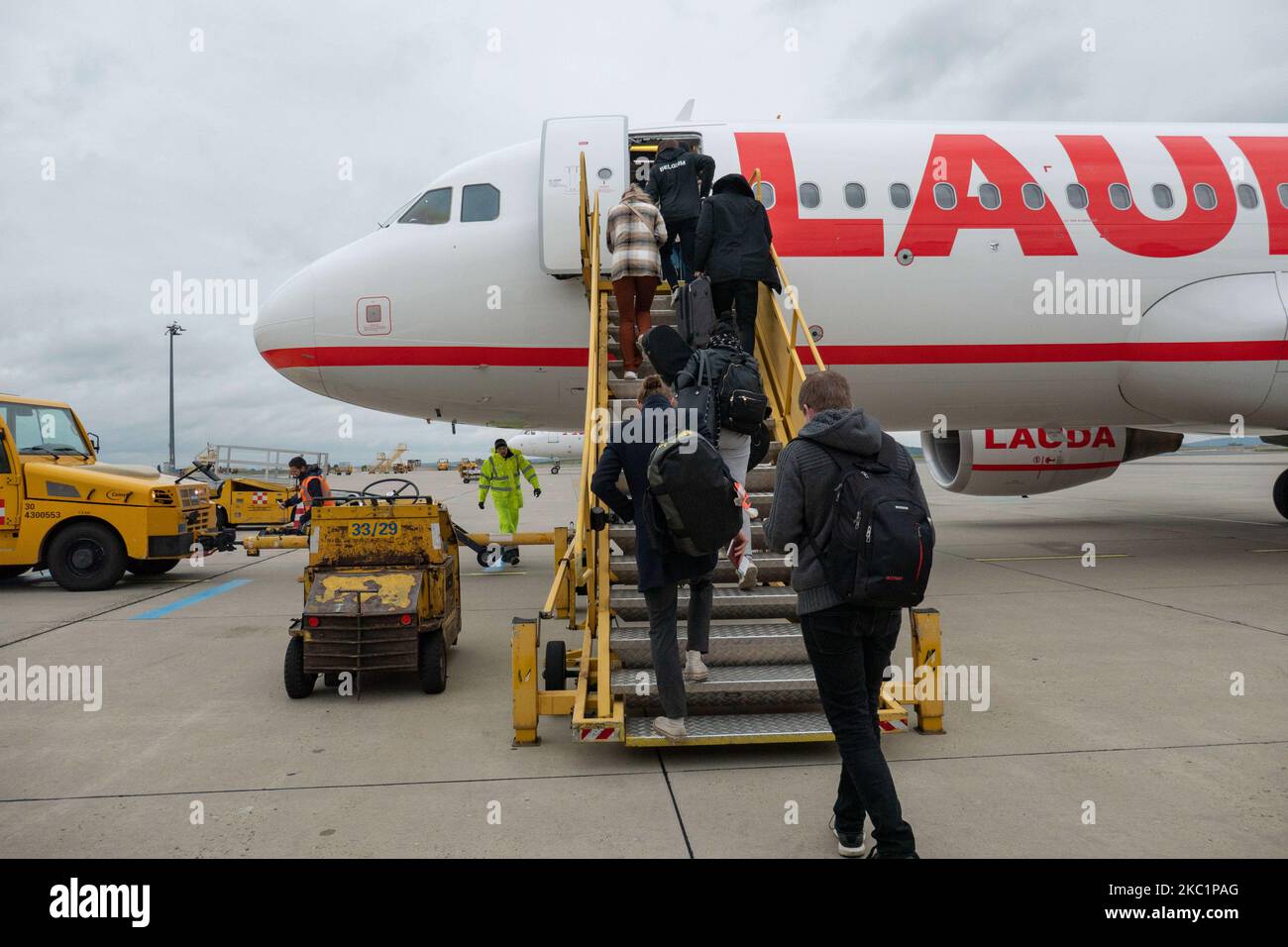 Passengers boarding in the plane for the flight in Vienna. Flying with ...