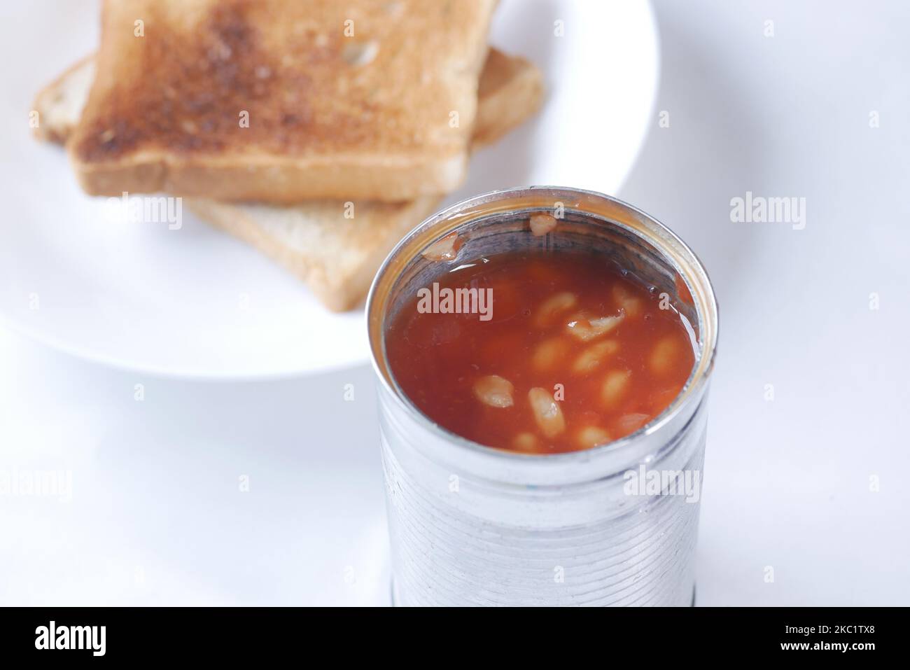 close up of preserved beans in a tin container on white Stock Photo - Alamy