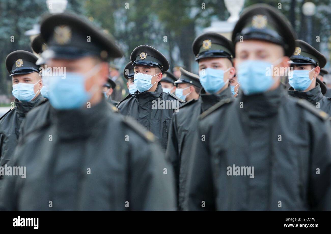 Future army officers stand lined up before the oath ceremony in Kyiv ...