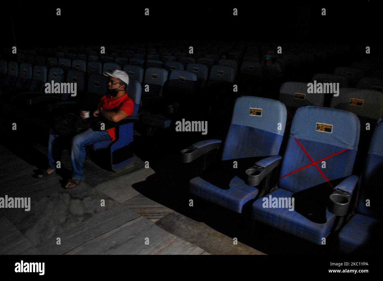 Social distancing marks inside a movie theater in Kolkata, India, on ...