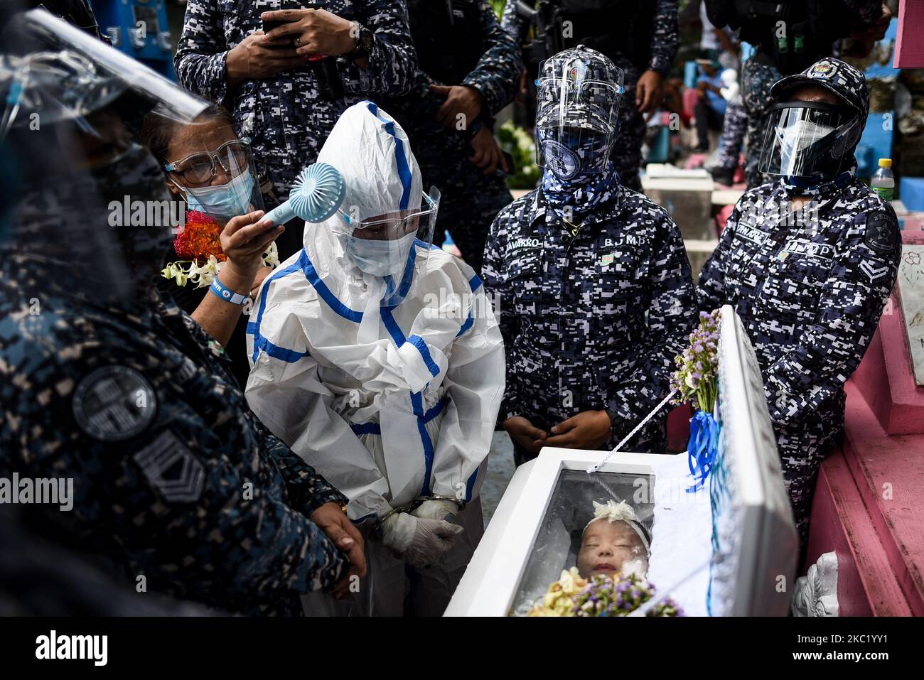 Political detainee Reina Mae Nasino, wearing a full personal protective ...