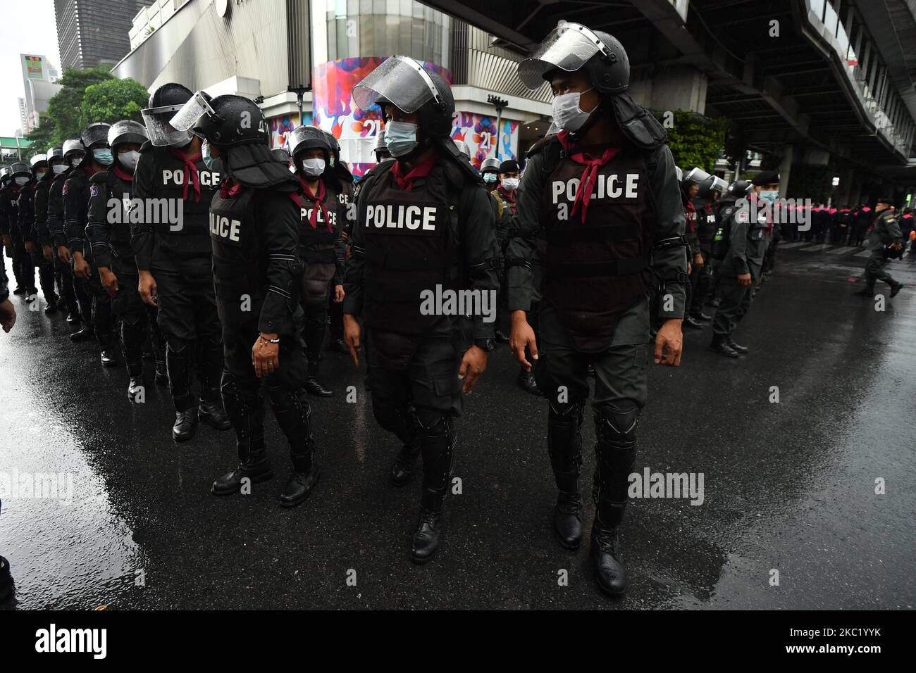 Riot police block street at Ratchaprasong intersection on October 16 ...