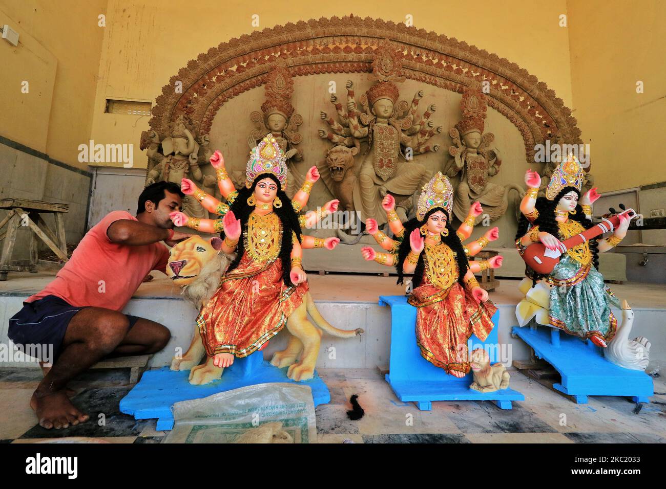 Jaipur: An artisan gives the final touches to an idol of Goddess Durga ...