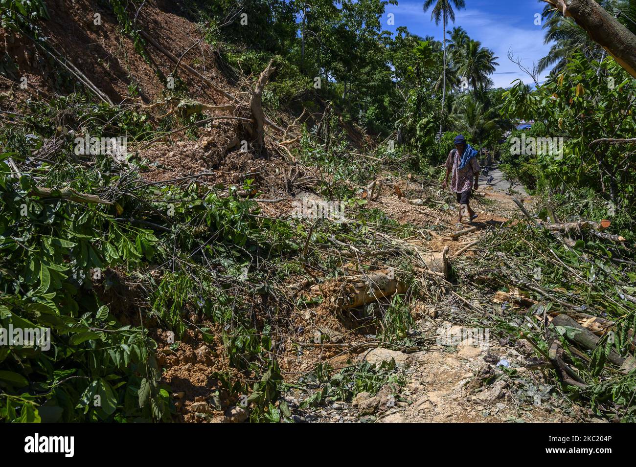 Residents walked through the landslide material that buried the only ...