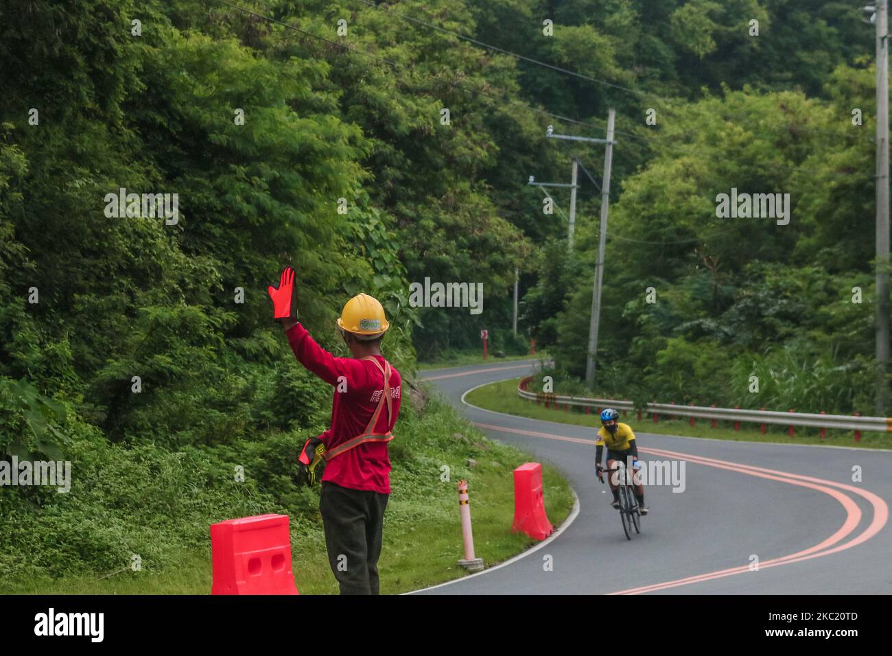 Worker in Marilaque Road directing the riders on October 17, 2020 in a ...