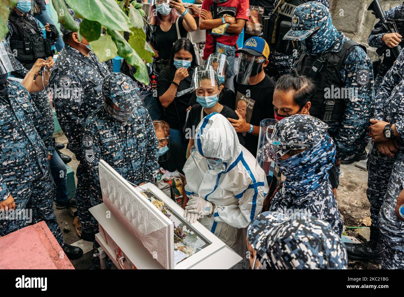 Political detainee Reina Mae Nasino, wearing full protective equipment ...