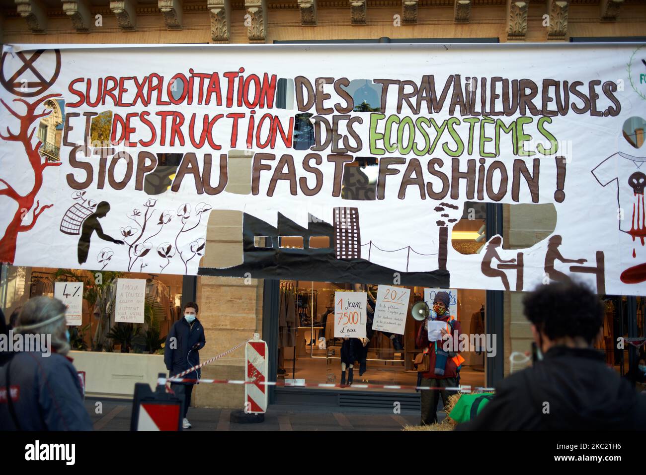 The banner put on a Zara shop reads 'Surexploitation of workers and ...