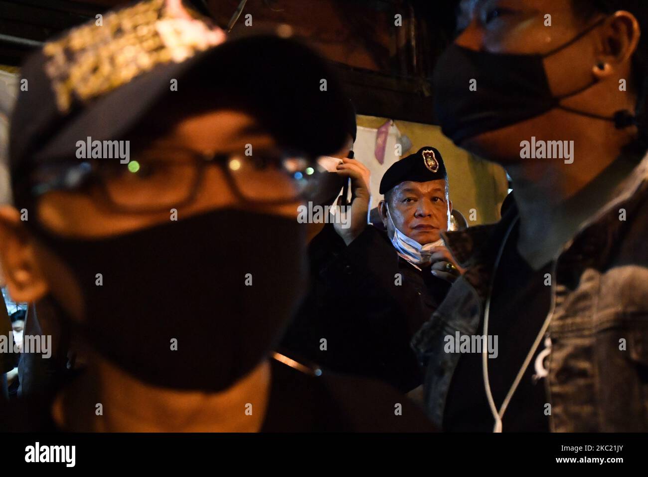 Lowered face masks hi-res stock photography and images - Alamy