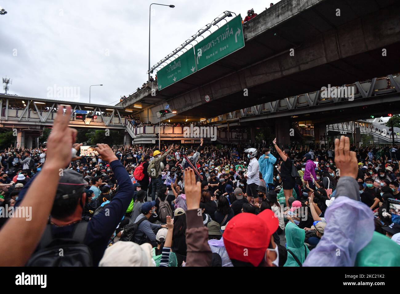 Pro-democracy protesters hold up three finger salute to protest an anti ...