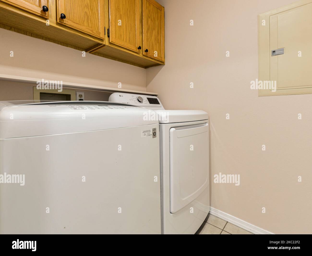 Modern residential laundry room interior Stock Photo - Alamy