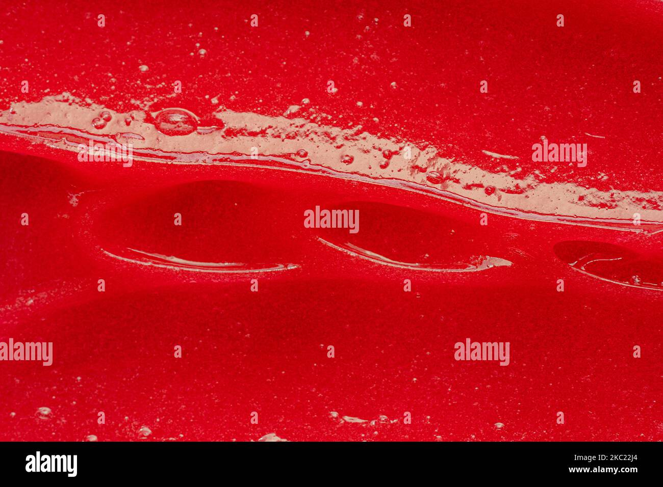 Red gel texture. Cosmetic clear liquid cream smudge. Skin care product ...