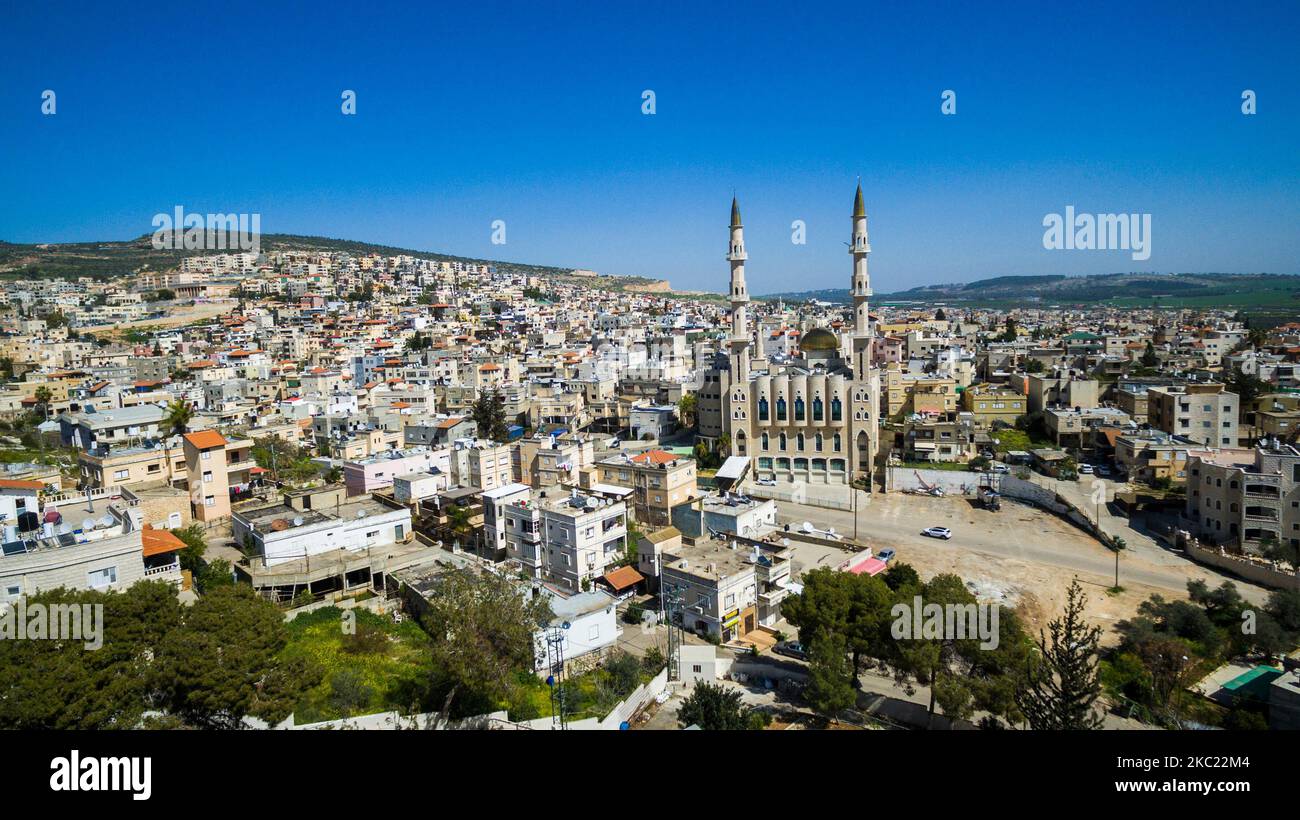 Aerial view flying over an arab cityscape buildings and streets, with ...