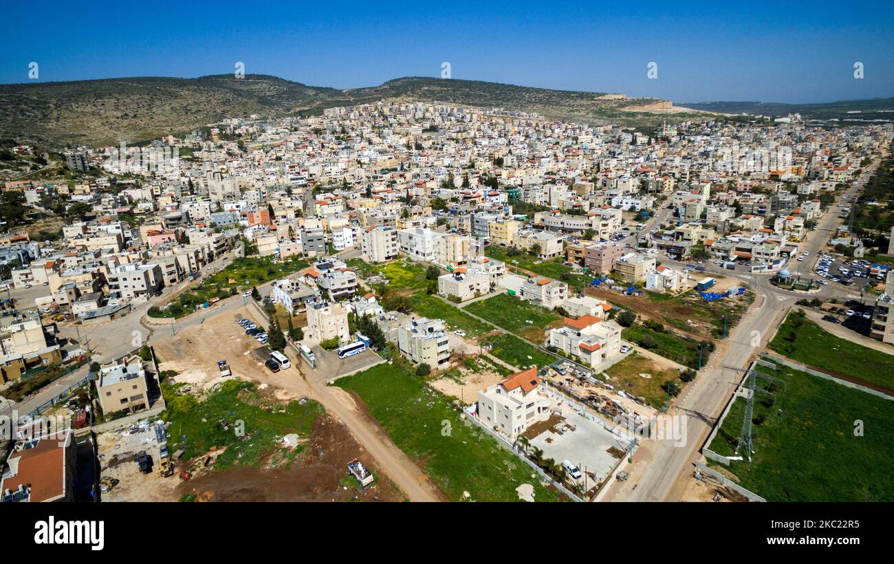 Aerial view flying over an arab cityscape buildings and streets, with ...