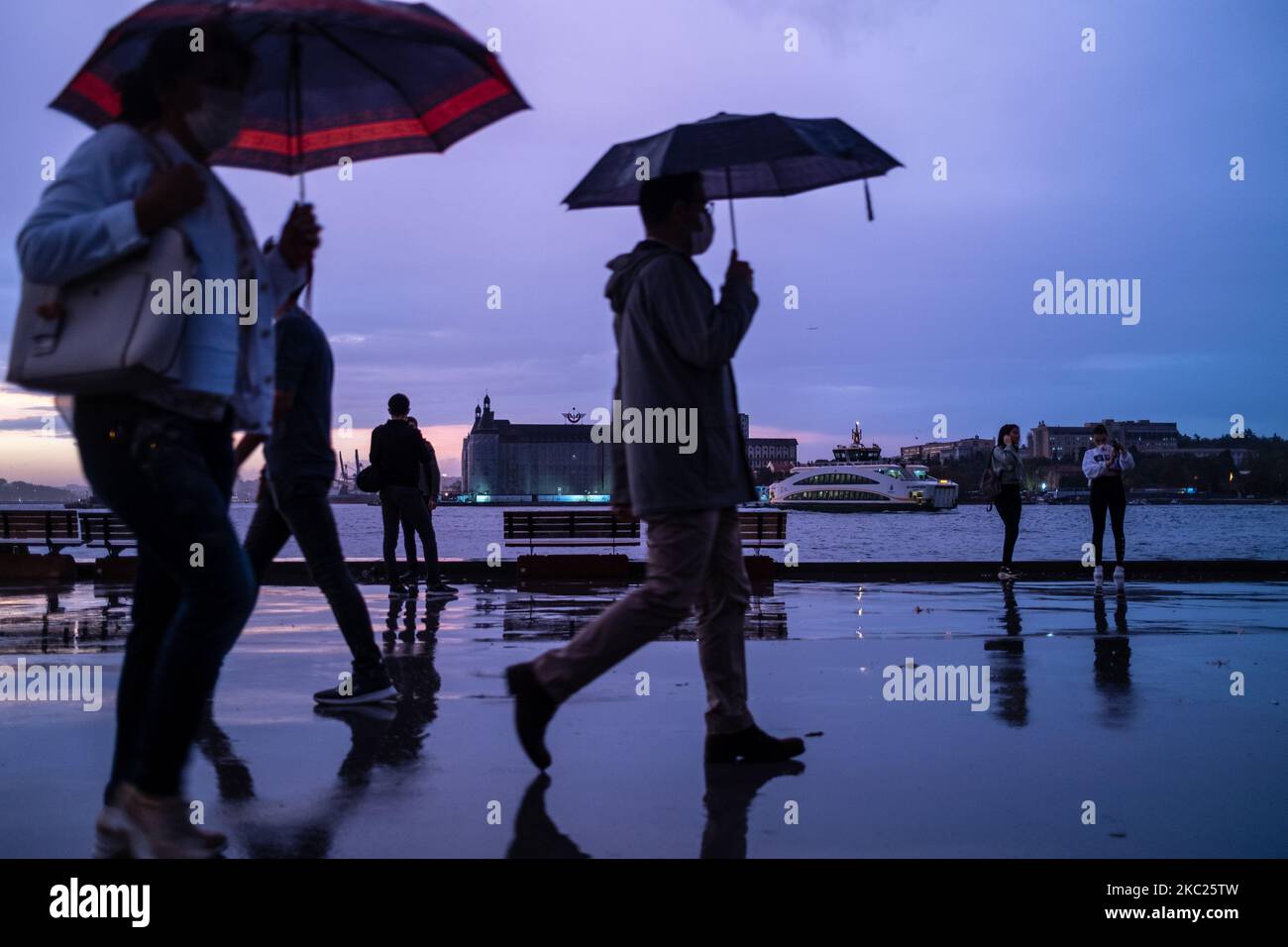 People run from heavy rainfall in Istanbul, Turkey on October 19, 2020 ...