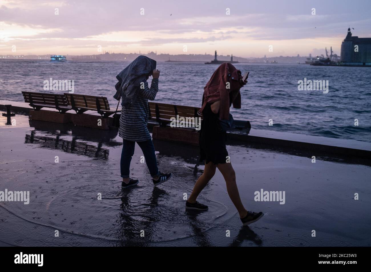 People run from heavy rainfall in Istanbul, Turkey on October 19, 2020 ...