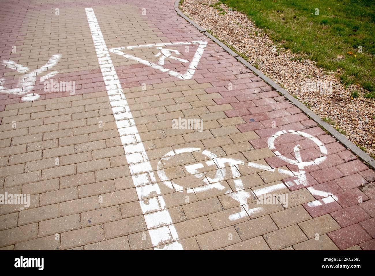 Bicycle path sign on paving slabs close up Stock Photo - Alamy