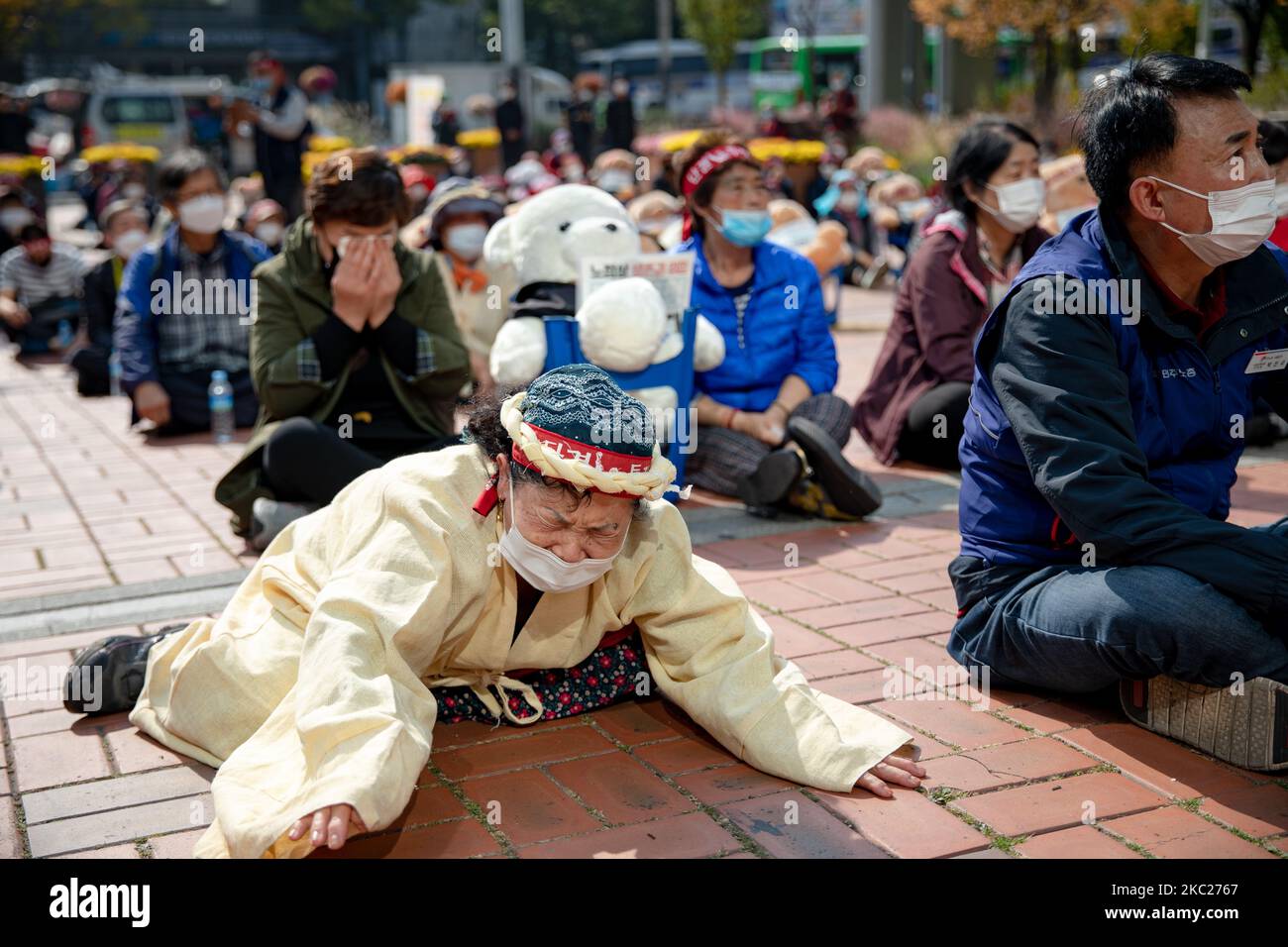 Merchants from the Federation of Street vendors shout slogans during a ...