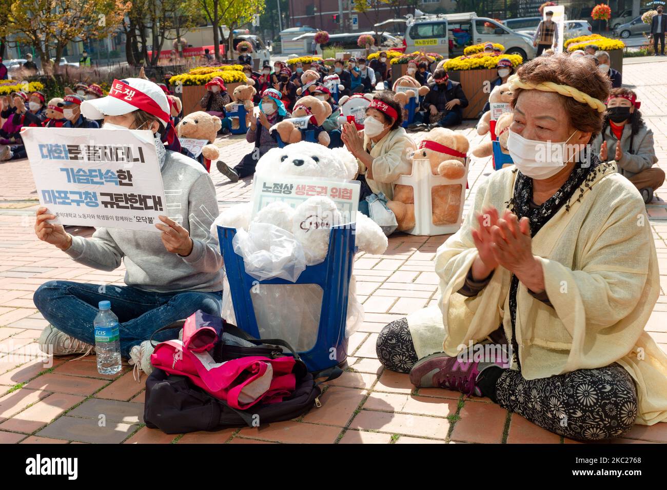 Merchants from the Federation of Street vendors shout slogans during a ...