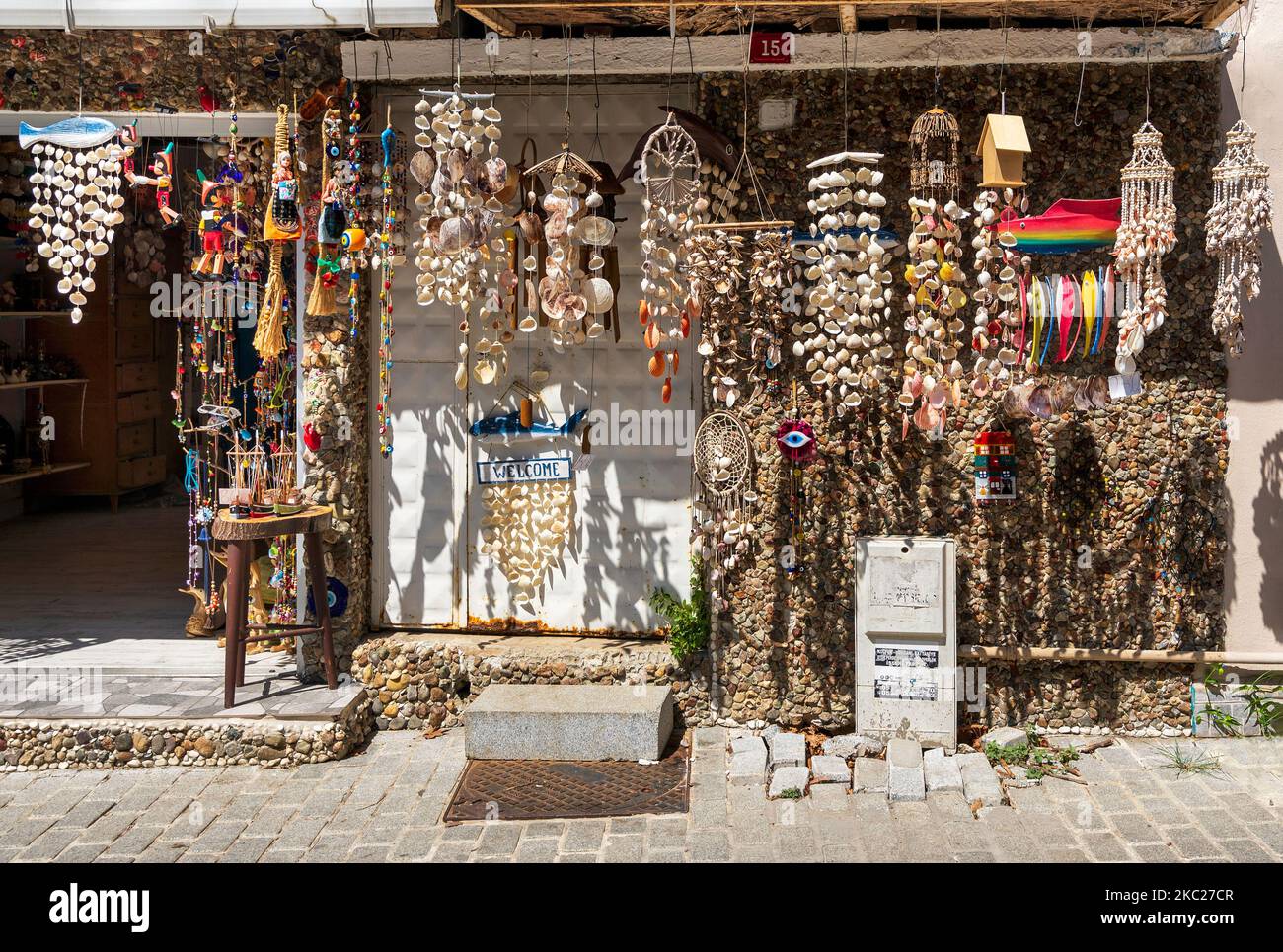 Storefront of souvenir store, with hanged handmade crafts made of sea ...