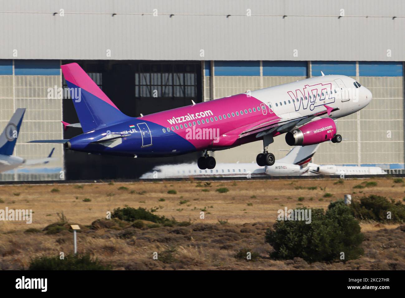 A Wizz Air budget airline Airbus A320-200 aircraft as seen during taxiing, takeoff, rotation and ...