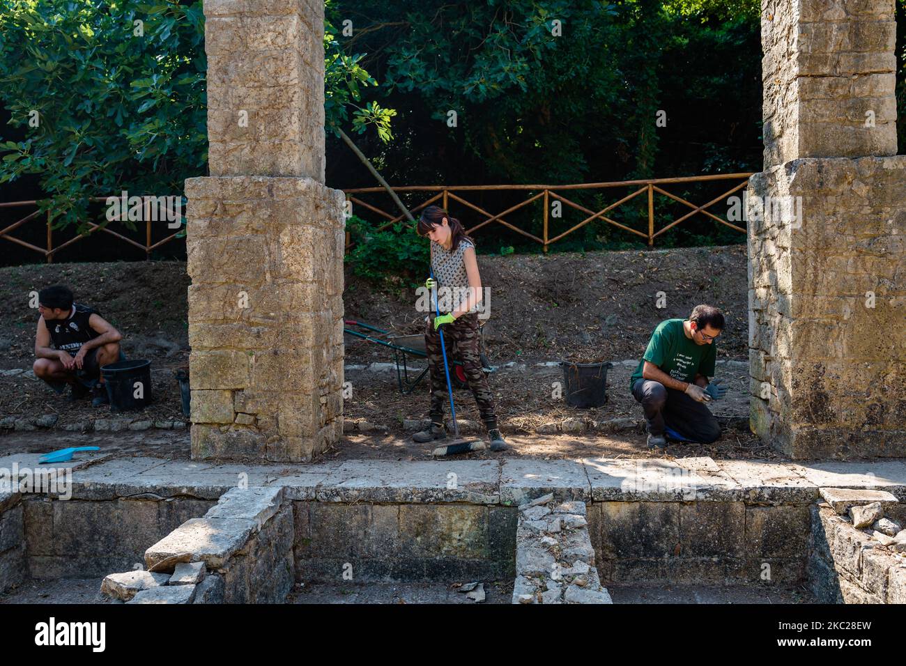 Archaeologists inside the Pulo di Molfetta, a karst sinkhole, near the ...