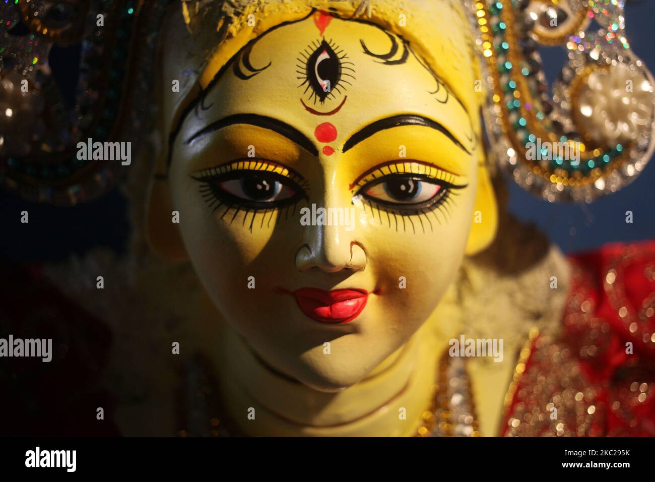 A clay idol of Goddess Durga in seen prepared for delivery at a ...