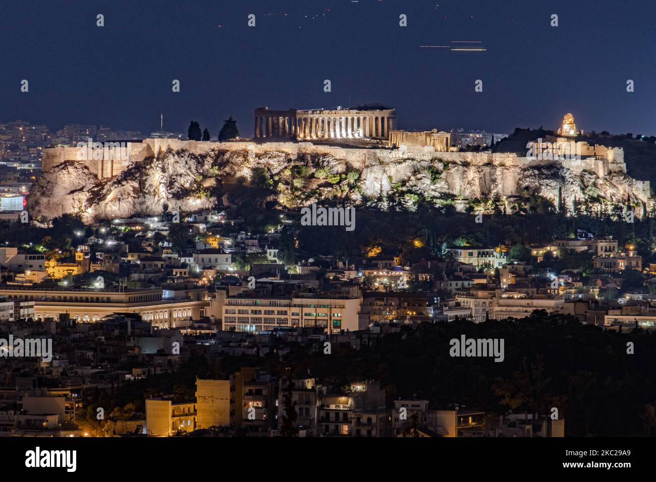 Night view of the Parthenon and Acropolis in the Greek capital Athina. Long exposure photography ...