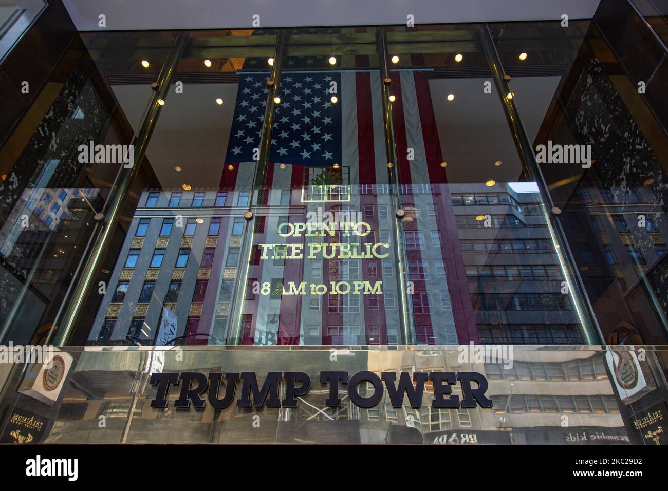 The main entrance of Trump Tower with the inscription on it and a US ...
