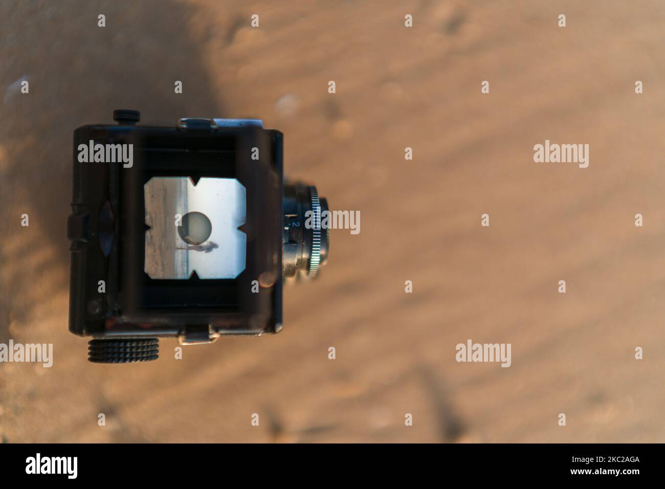 A top view of a black twin-lens reflex camera on the sand Stock Photo ...