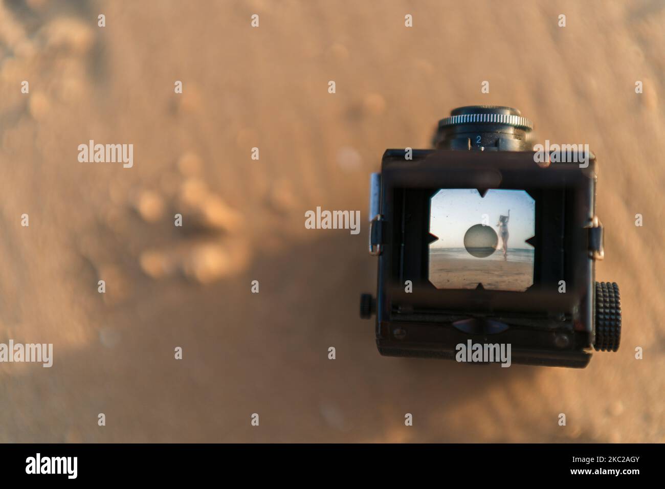 A top view of a black twin-lens reflex camera on the sand Stock Photo ...