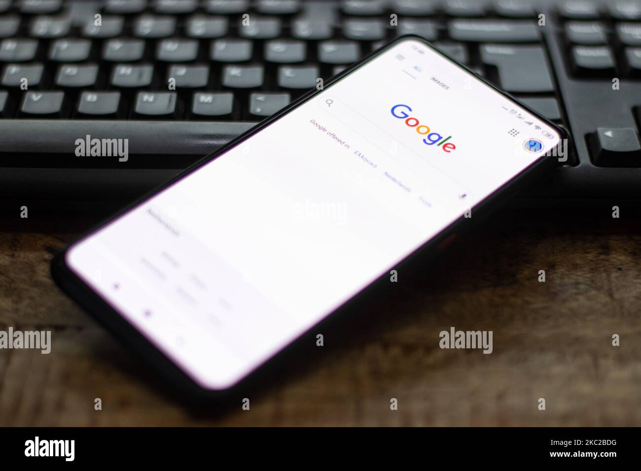 Google closeup logo displayed on a phone screen, smartphone on a ...