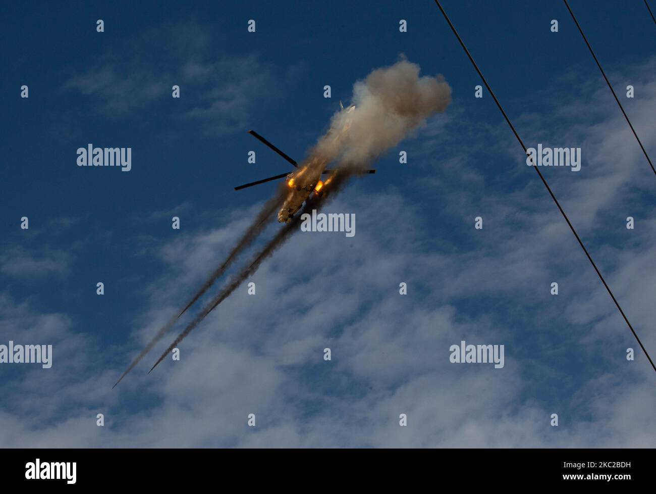 Military helicopter, launches rockets, during Military exercise of the ...