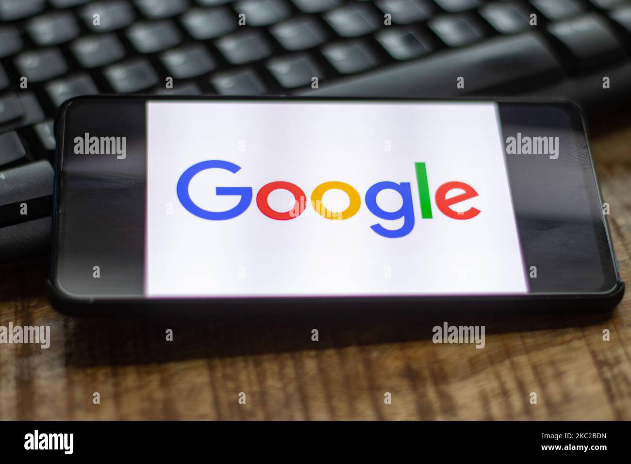 Google closeup logo displayed on a phone screen, smartphone on a ...
