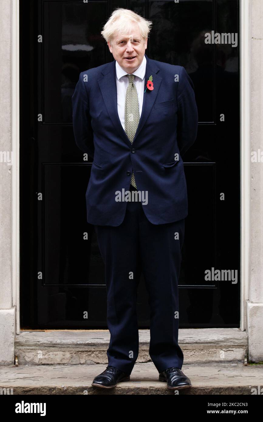 British Prime Minister Boris Johnson, wearing a remembrance poppy after ...