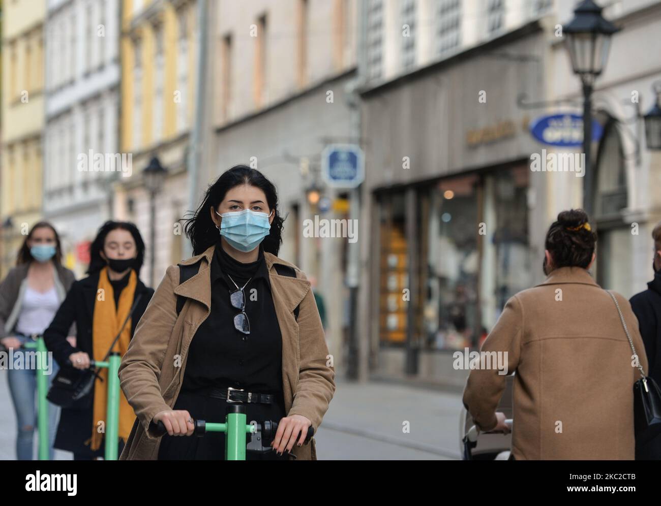 People wearing protective face masks seen in Krakow's center. Polish ...