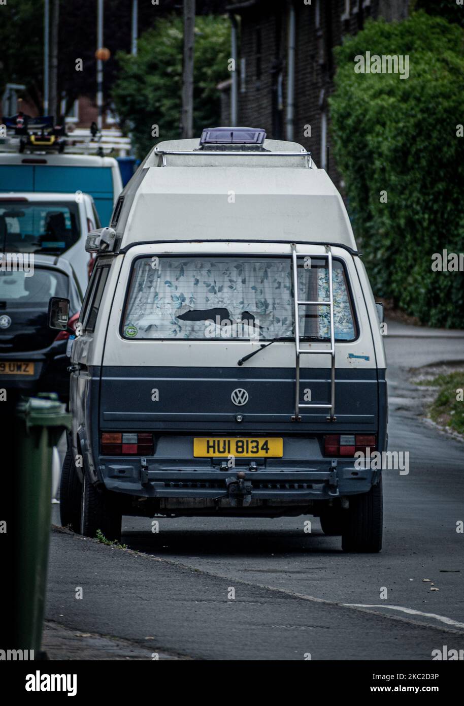 An old school travel van in the backstreets of a seaside town in ...