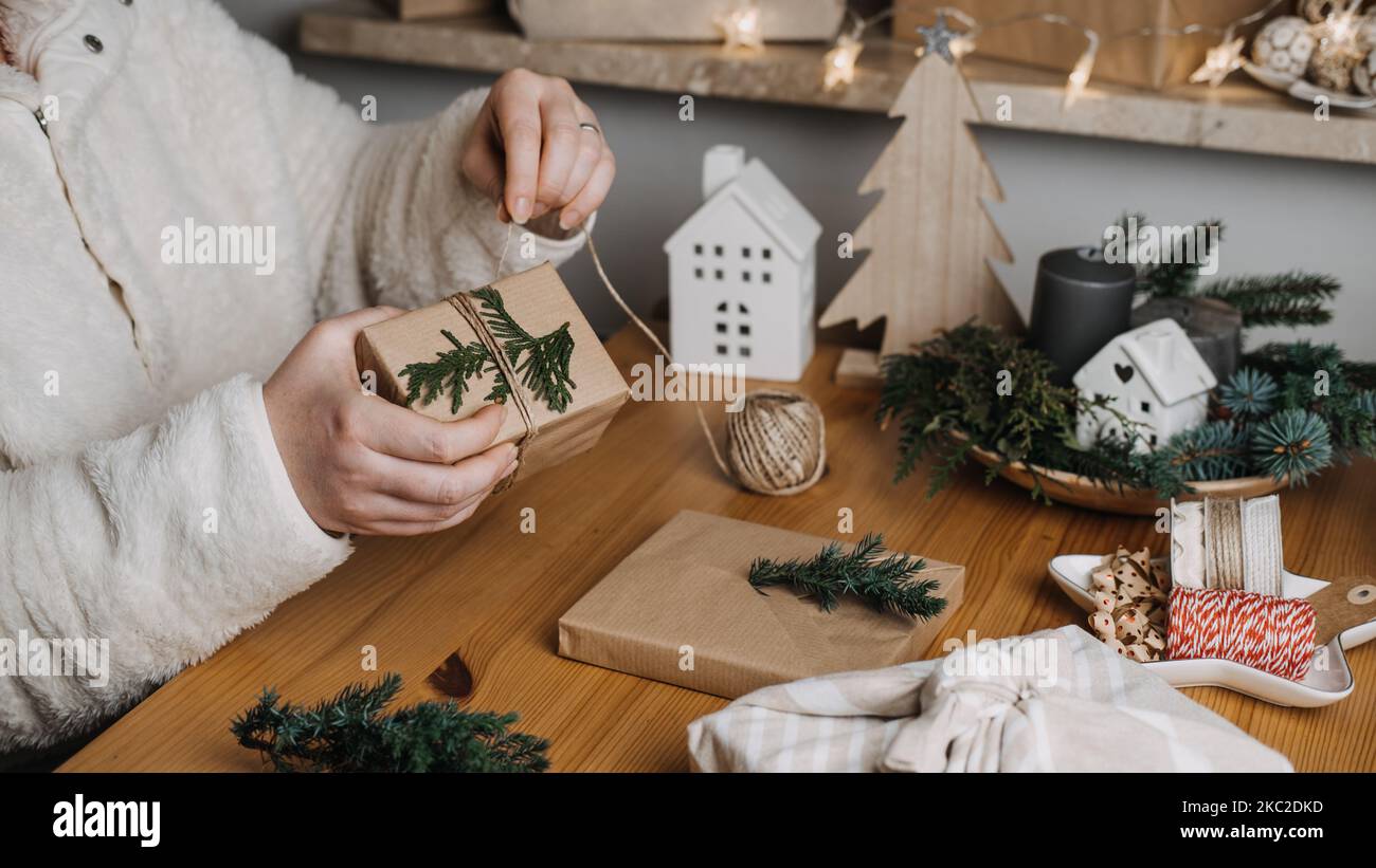 Christmas Zero waste eco friendly reuse wrapping gifts process. Woman ...