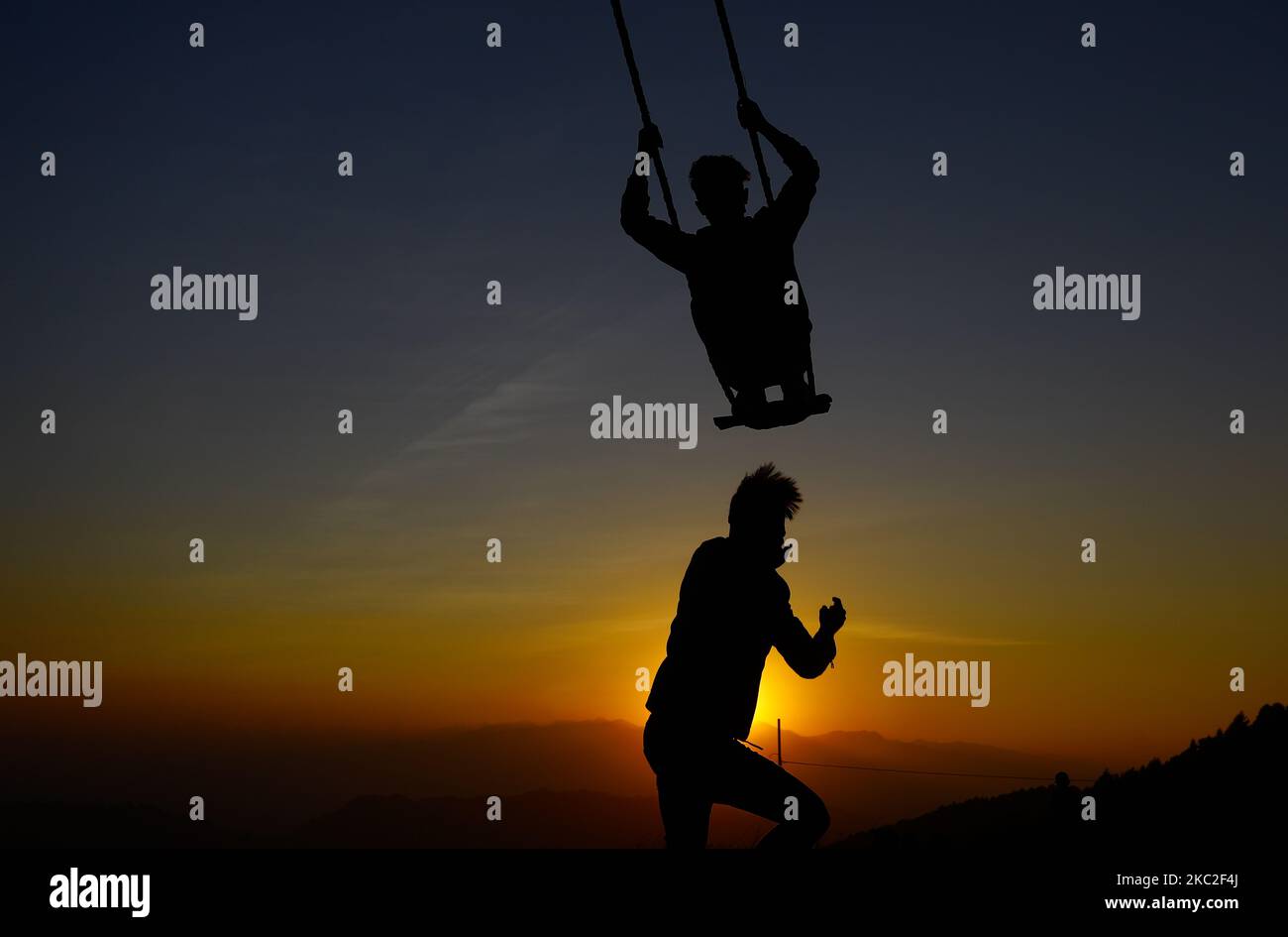 A boy plays on a traditional swing during Dashain, the biggest ...