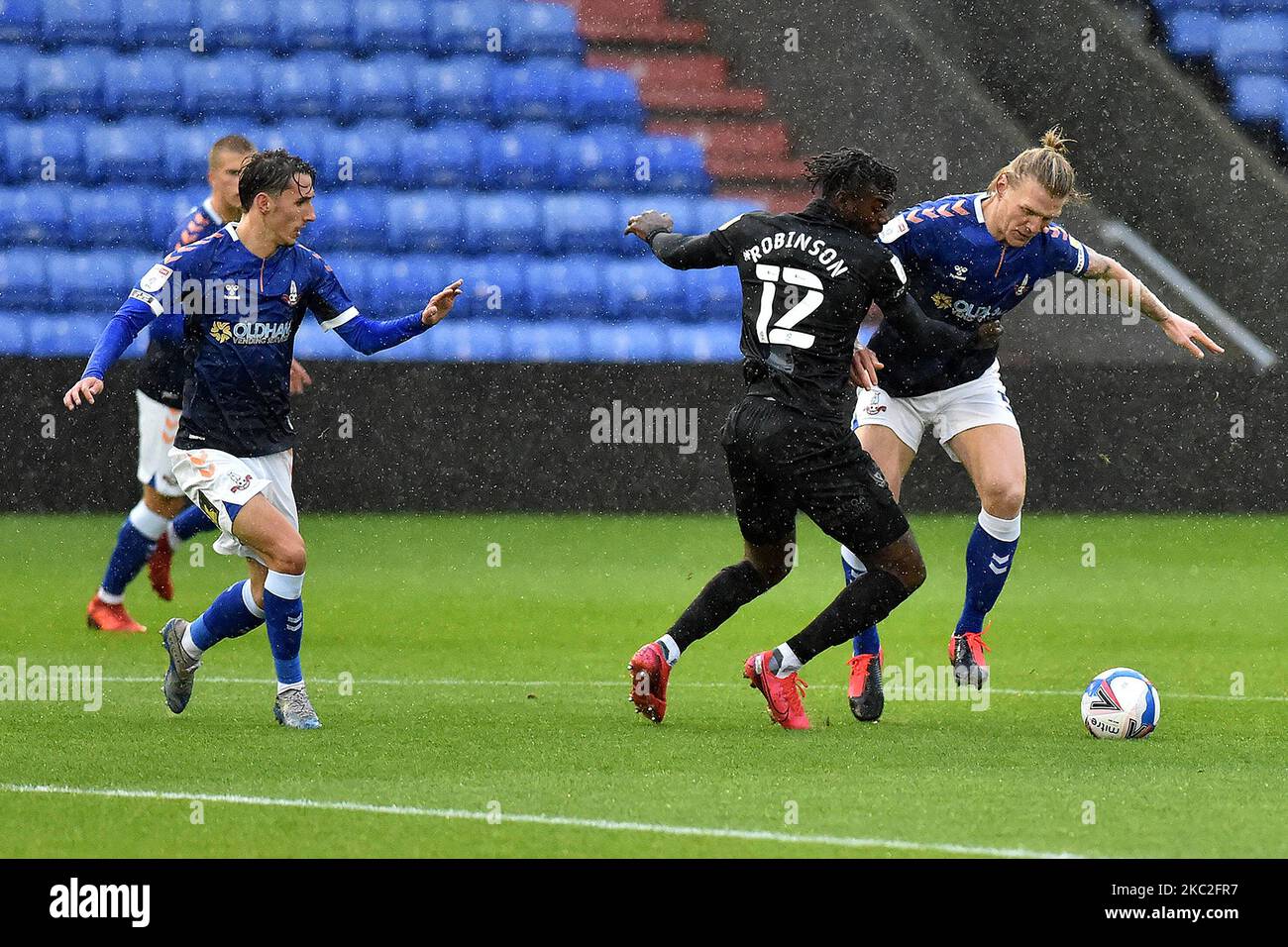 Oldham Athletic's Carl Piergianni and Callum Whelan and Port Vale's ...